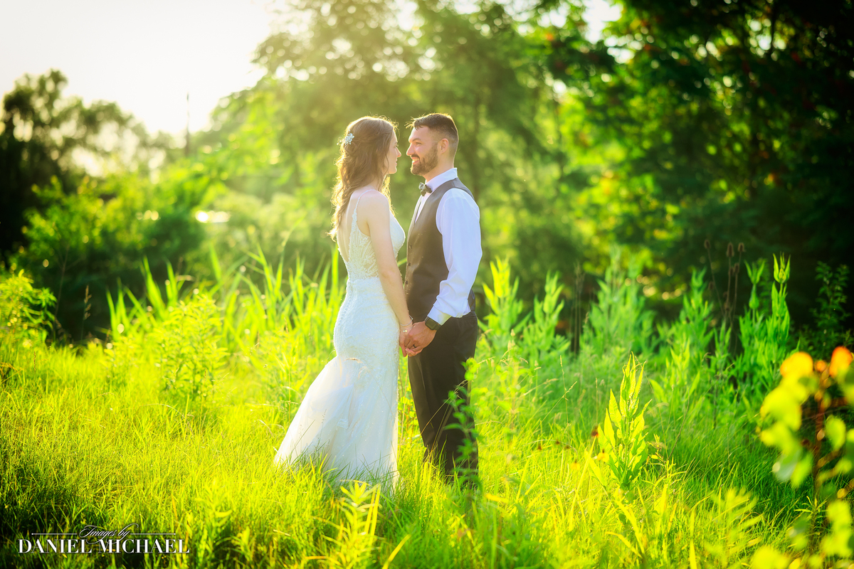 Light and Airy Wedding Photography of Couple in field